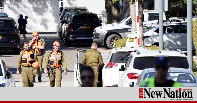 Israeli soldiers walk along a street leading to Prime Minister Benjamin ...